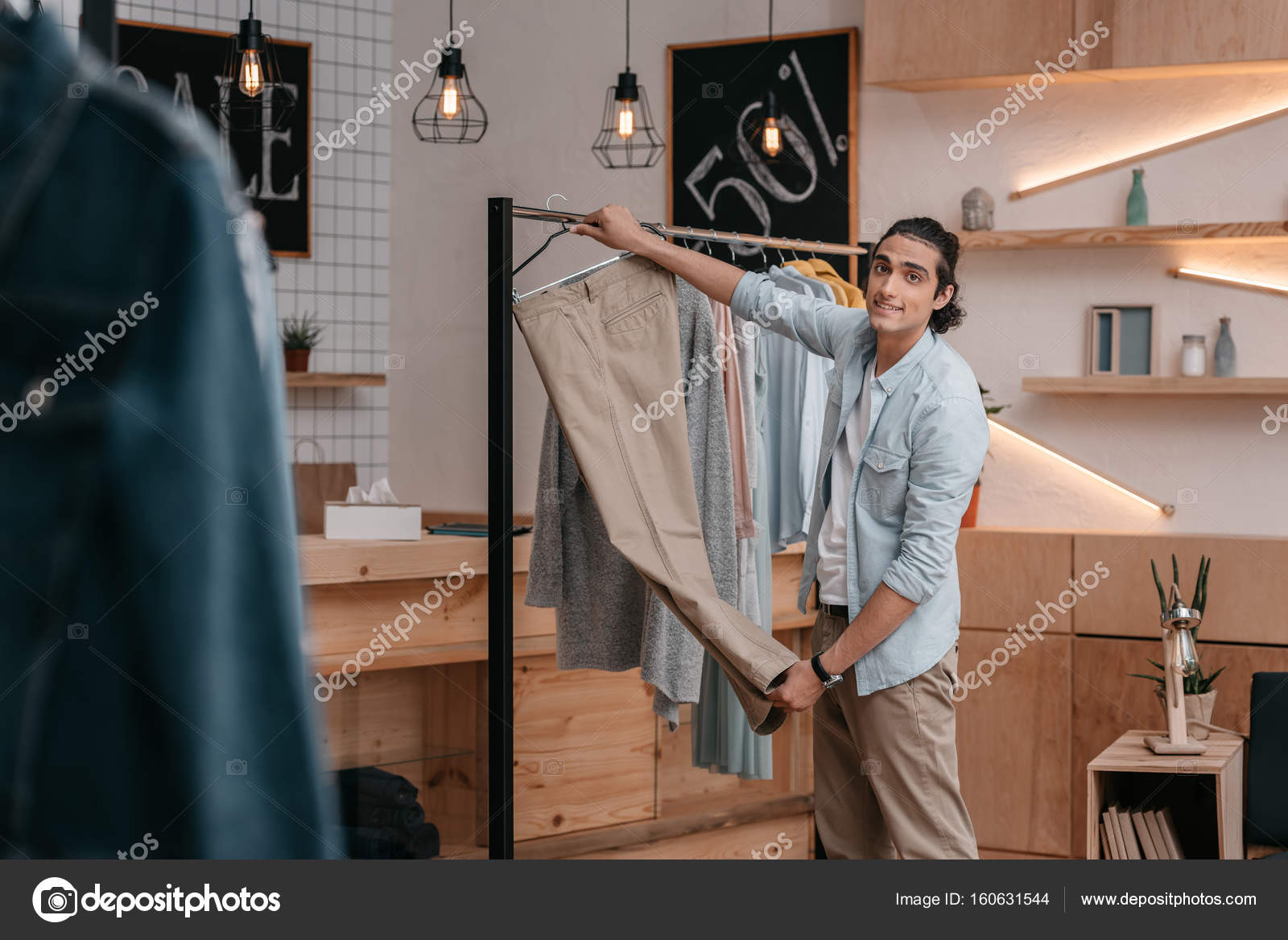 Man working in boutique Stock Photo by ©AllaSerebrina 160631544