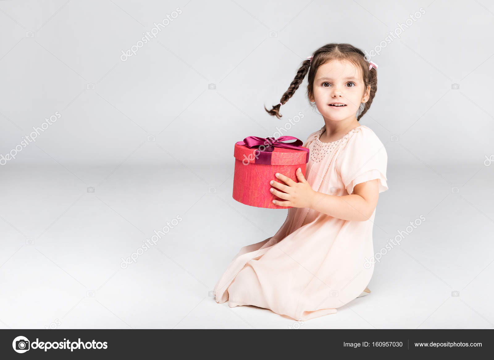 Adorable girl with present Stock Photo by ©AllaSerebrina 160957030