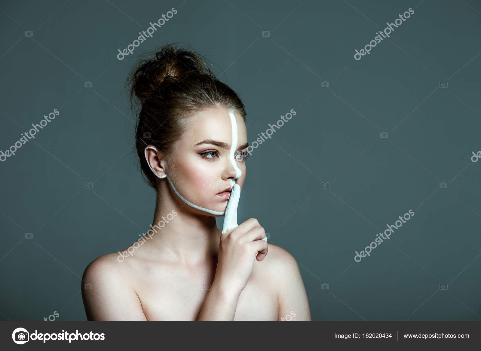 Beautiful girl with hush sign — Stock Photo © AllaSerebrina #162020434