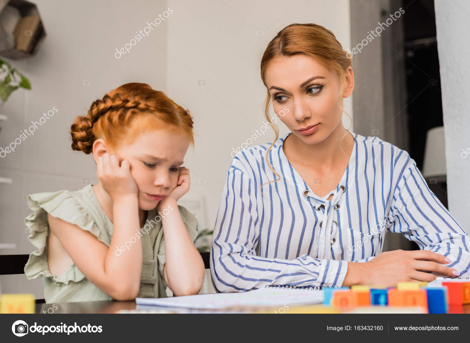 Mother looking sceptical on sad daughter Stock Photo by ©AllaSerebrina ...