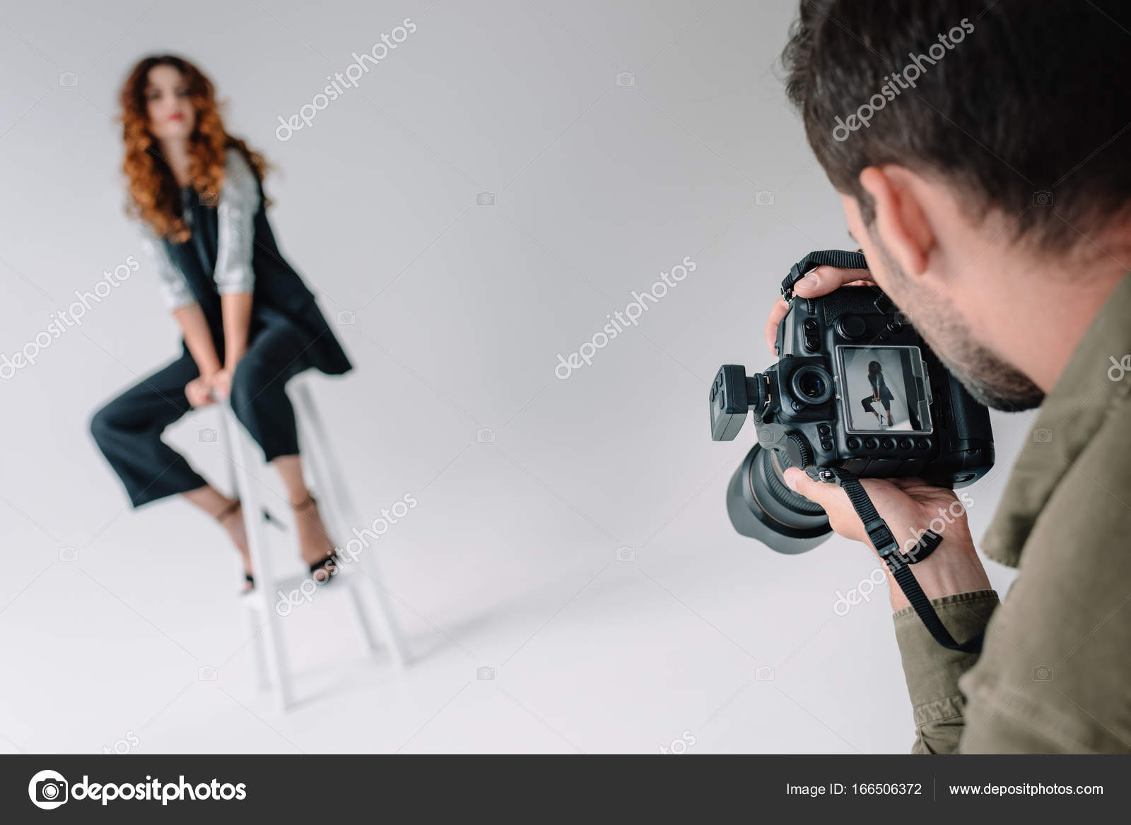 Photographer and attractive model — Stock Photo © AllaSerebrina #166506372