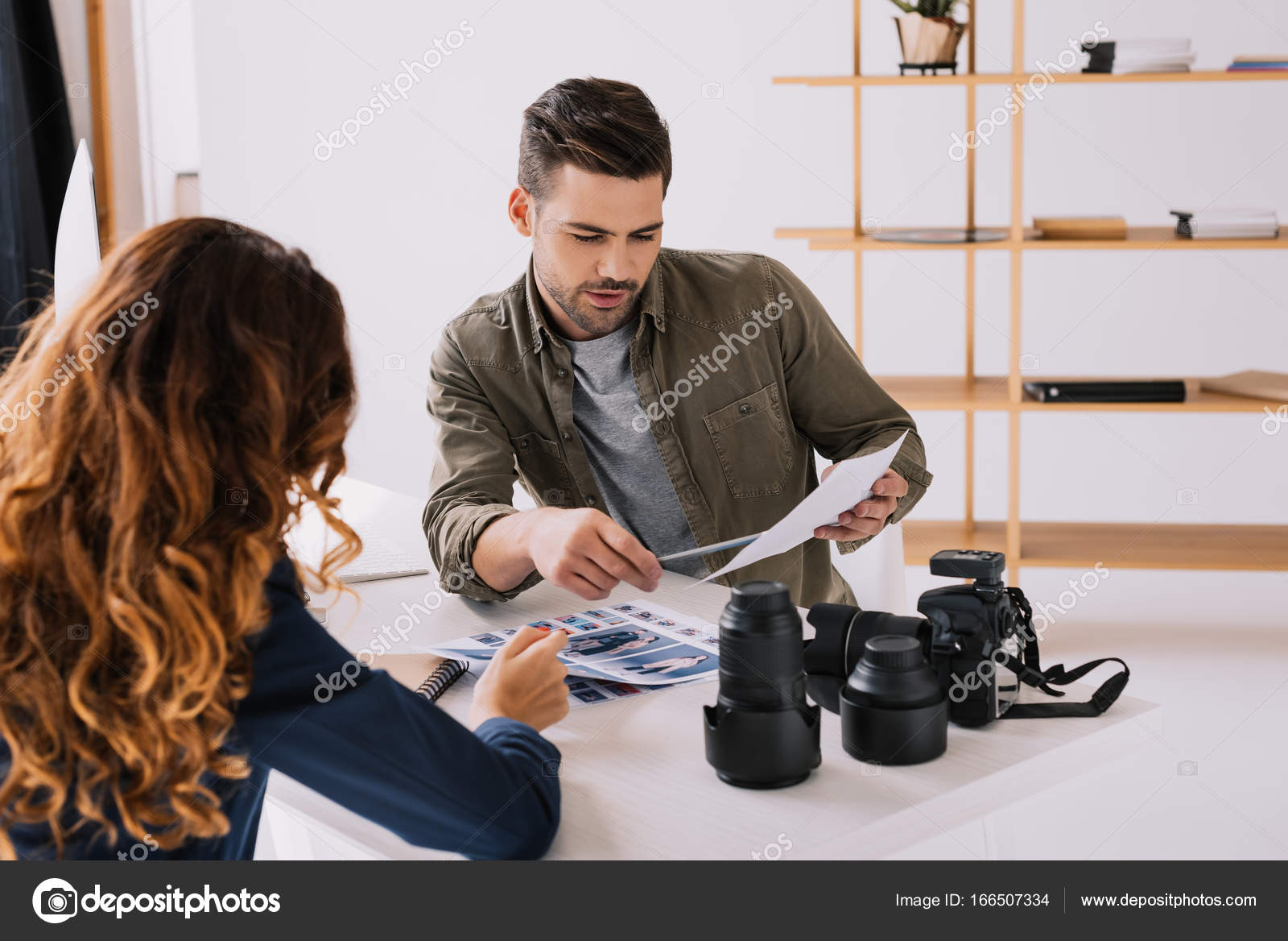 Photographer and model choosing photos — Stock Photo © AllaSerebrina ...