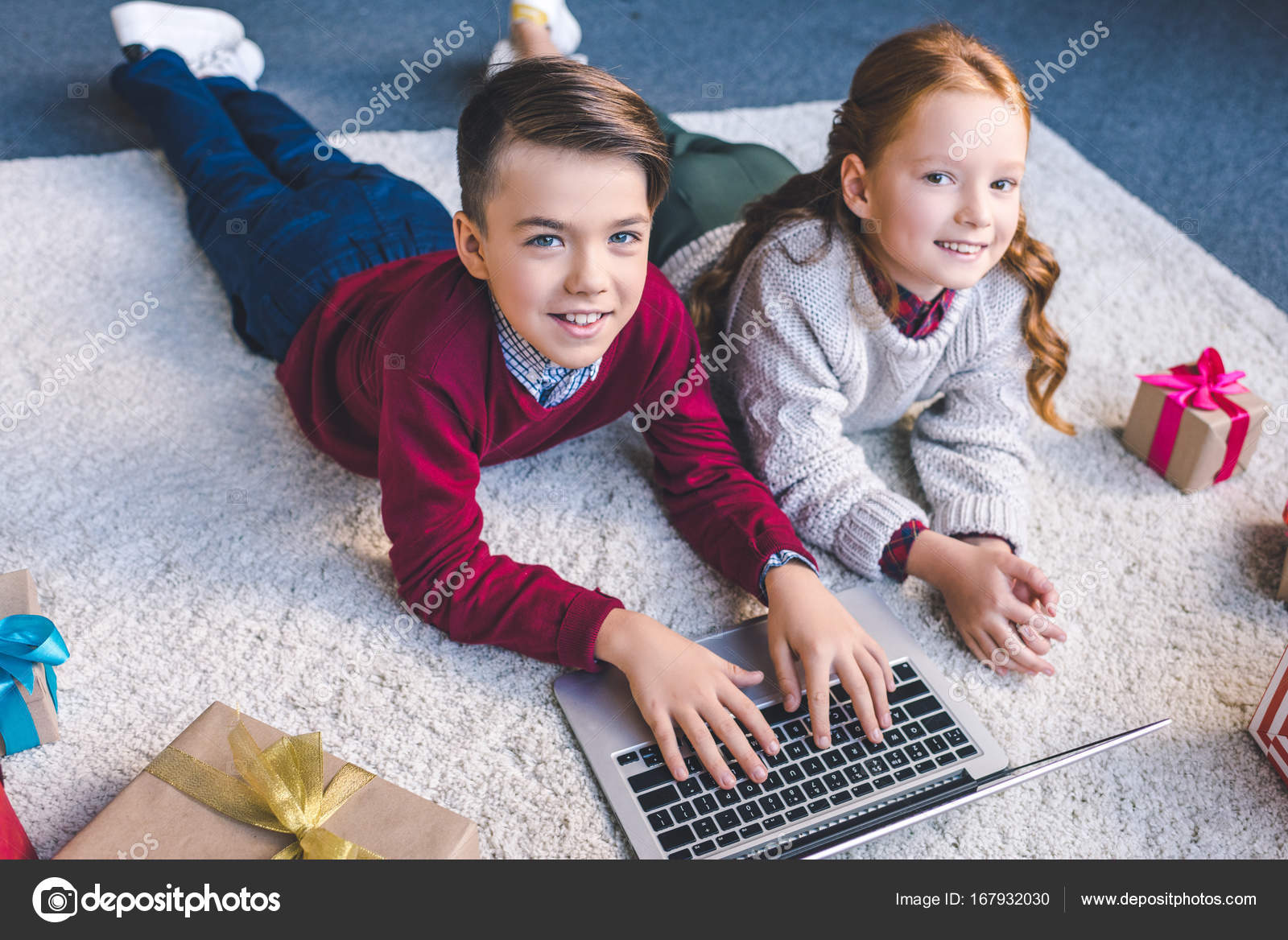 Brother and sister using laptop together — Stock Photo © AllaSerebrina ...