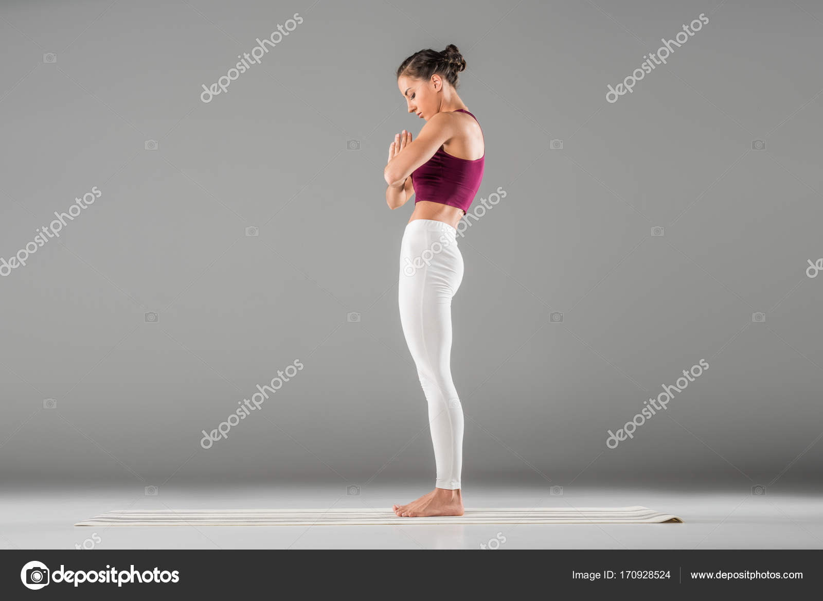 Woman standing in yoga pose — Stock Photo © AllaSerebrina #170928524
