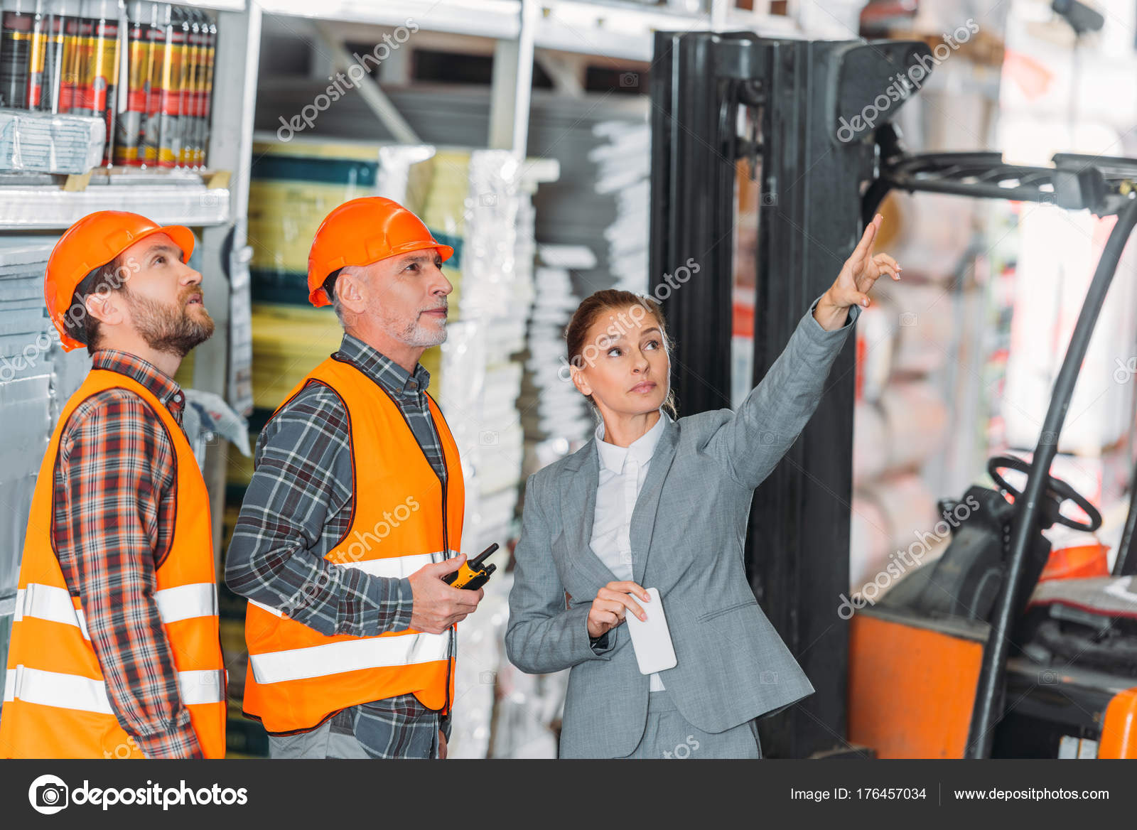 Female Inspector Showing Something Workers Storehouse — Stock Photo ...
