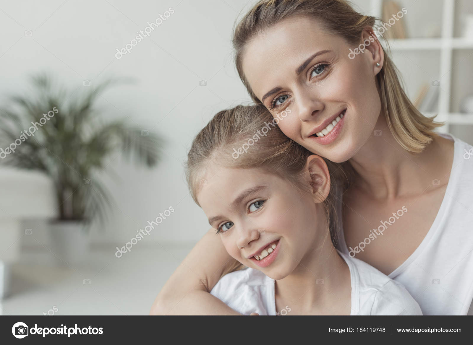 Close Portrait Mother Daughter Embracing Home Stock Photo by ©AllaSerebrina 184119748