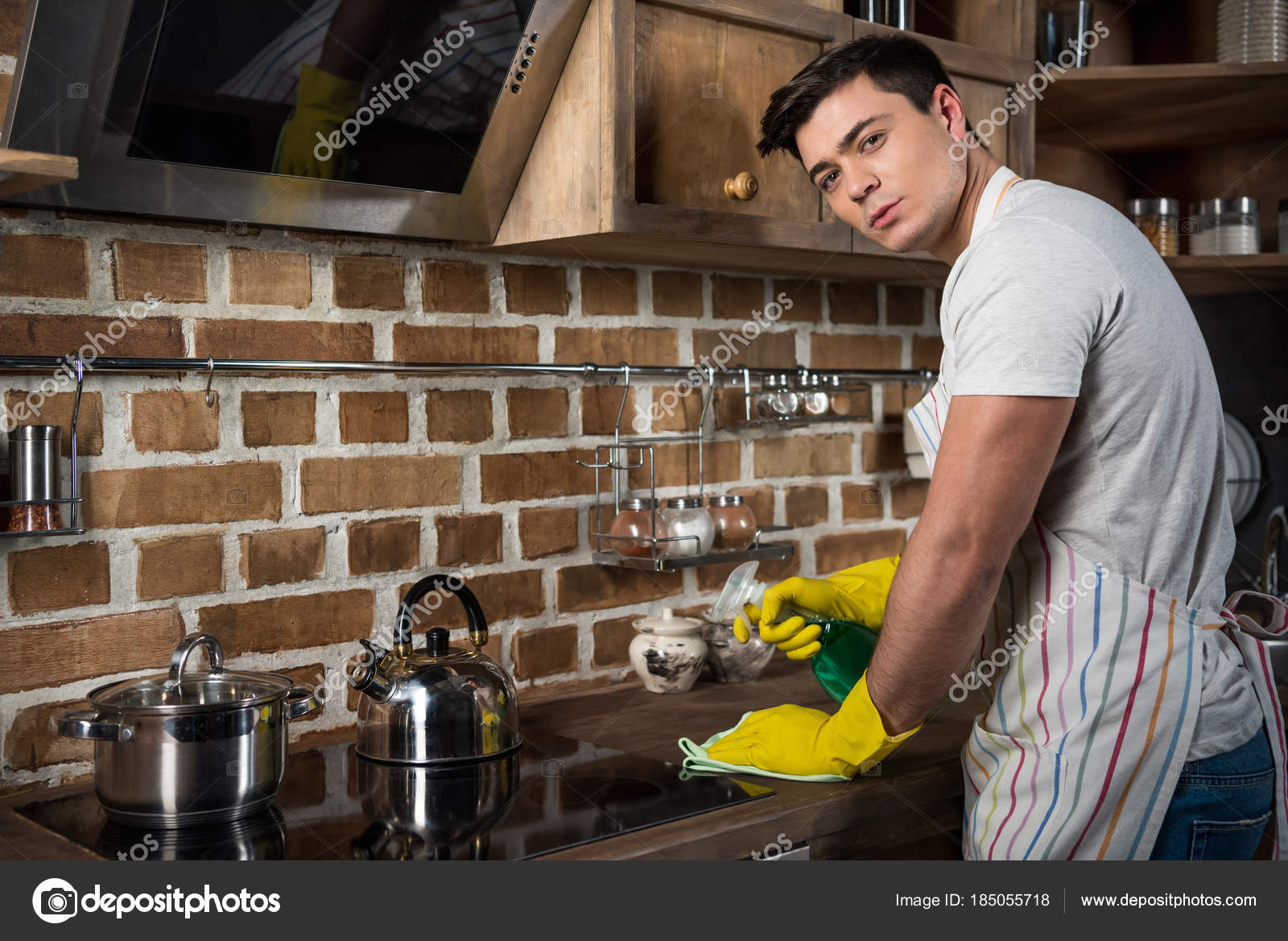 Handsome Man Cleaning Kitchen Spray Bottle Rag Looking Camera Stock ...