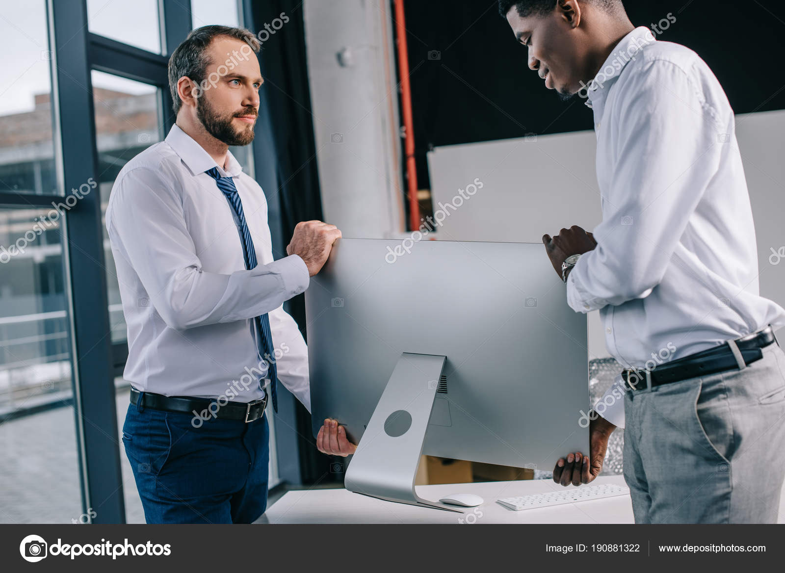 Holding desktop computer Stock Photo by ©AllaSerebrina 190881322