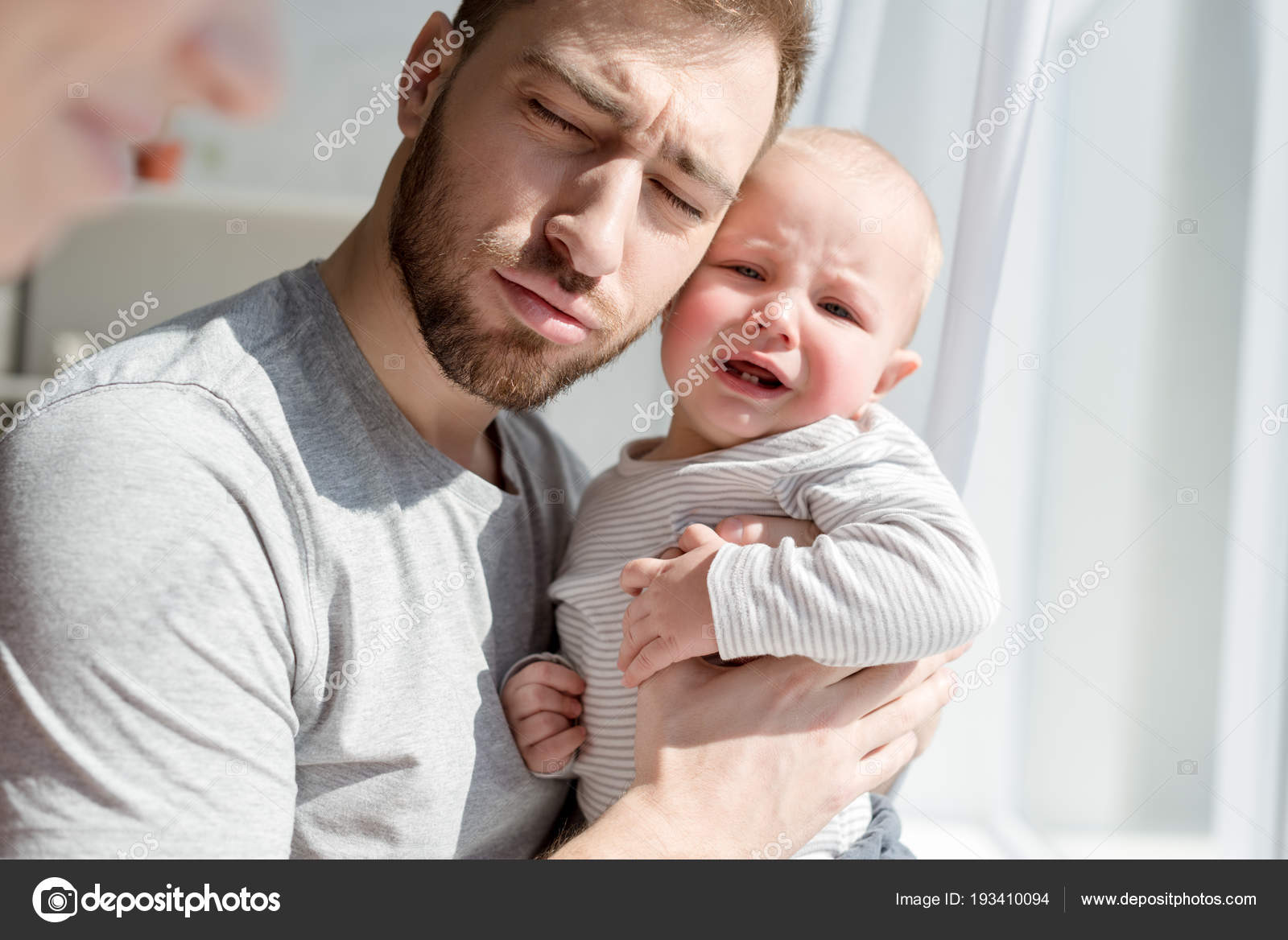 Young Father Holding Crying Little Son Stock Photo by ©AllaSerebrina ...