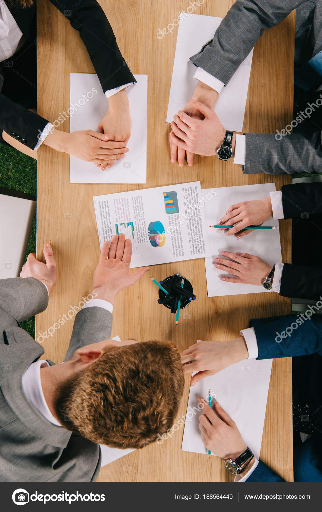 Top View Businessman Pointing Diagram Business Partners Table Office ...