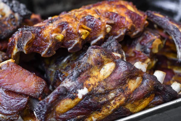 Marinated pork spare ribs, stack or pile of fresh grilled meat during ...