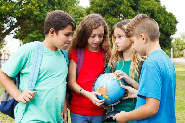 Kids with globe — Stock Photo © DragonImages #31308261