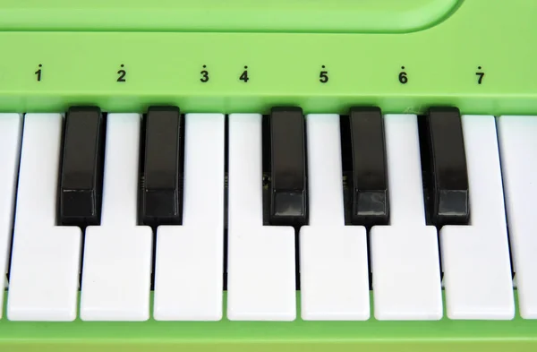 Keyboard toy. Green plastic keyboard. - Stock Image - Everypixel