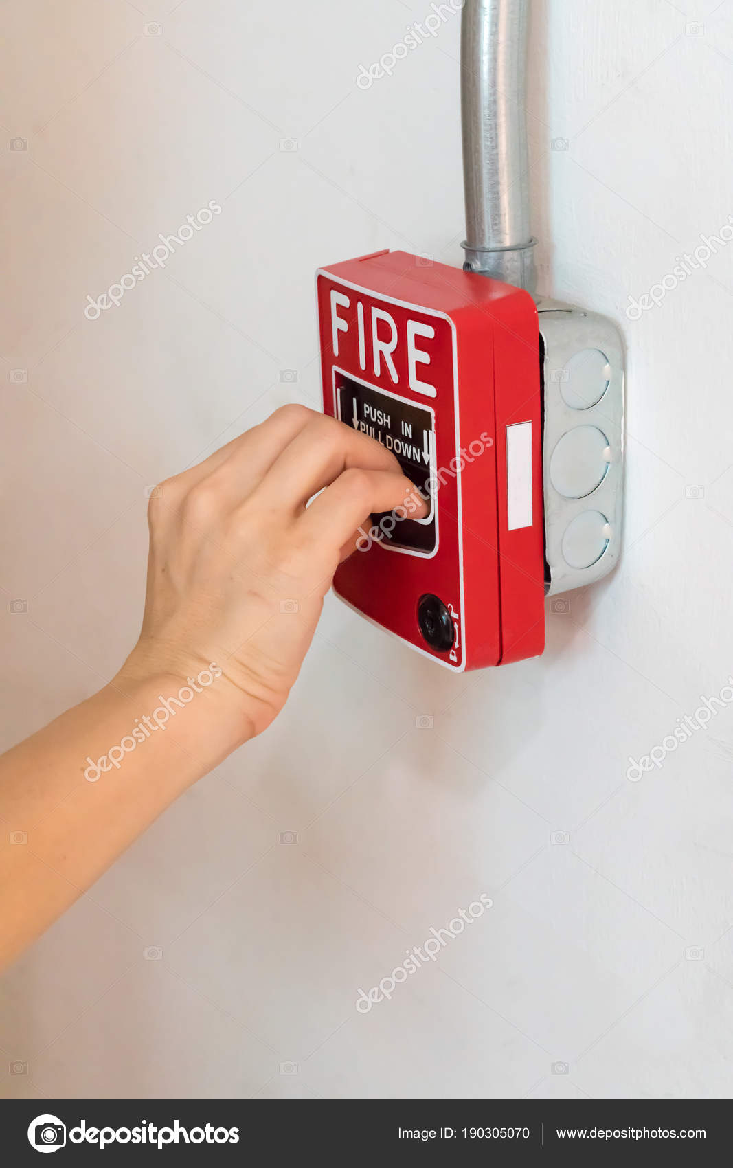 Hand pushing the push in pull down switch fire — Stock Photo © v74 ...