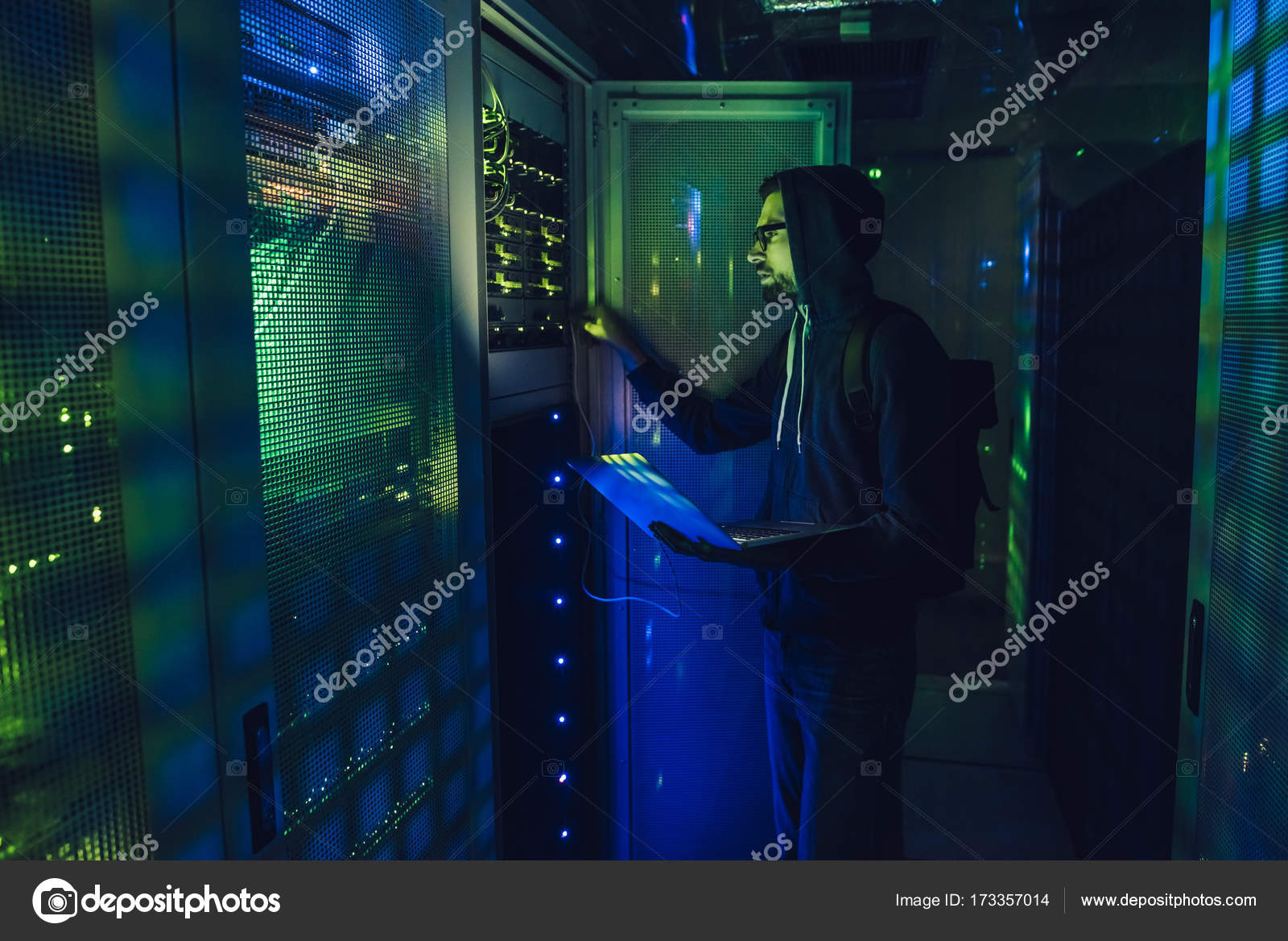 Hacker in data centre Stock Photo by ©4pmphoto@gmail.com 173357014