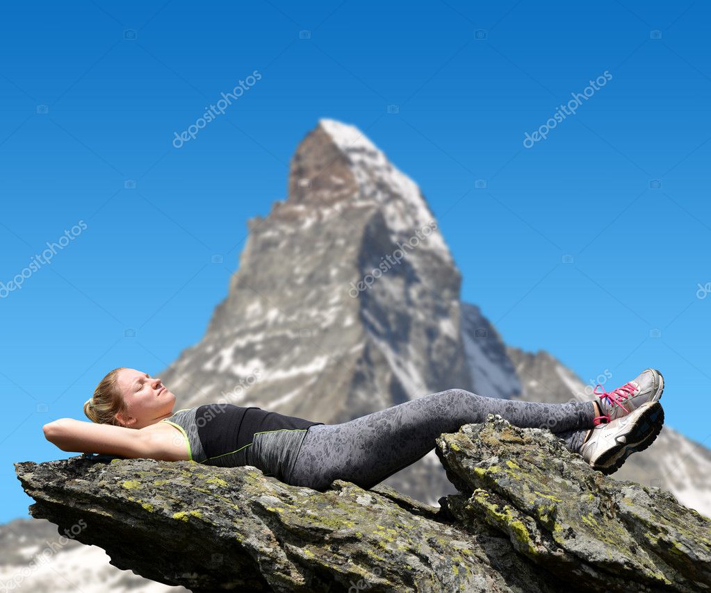 Tourist lying on a rock Stock Photo by ©vencav 127454478