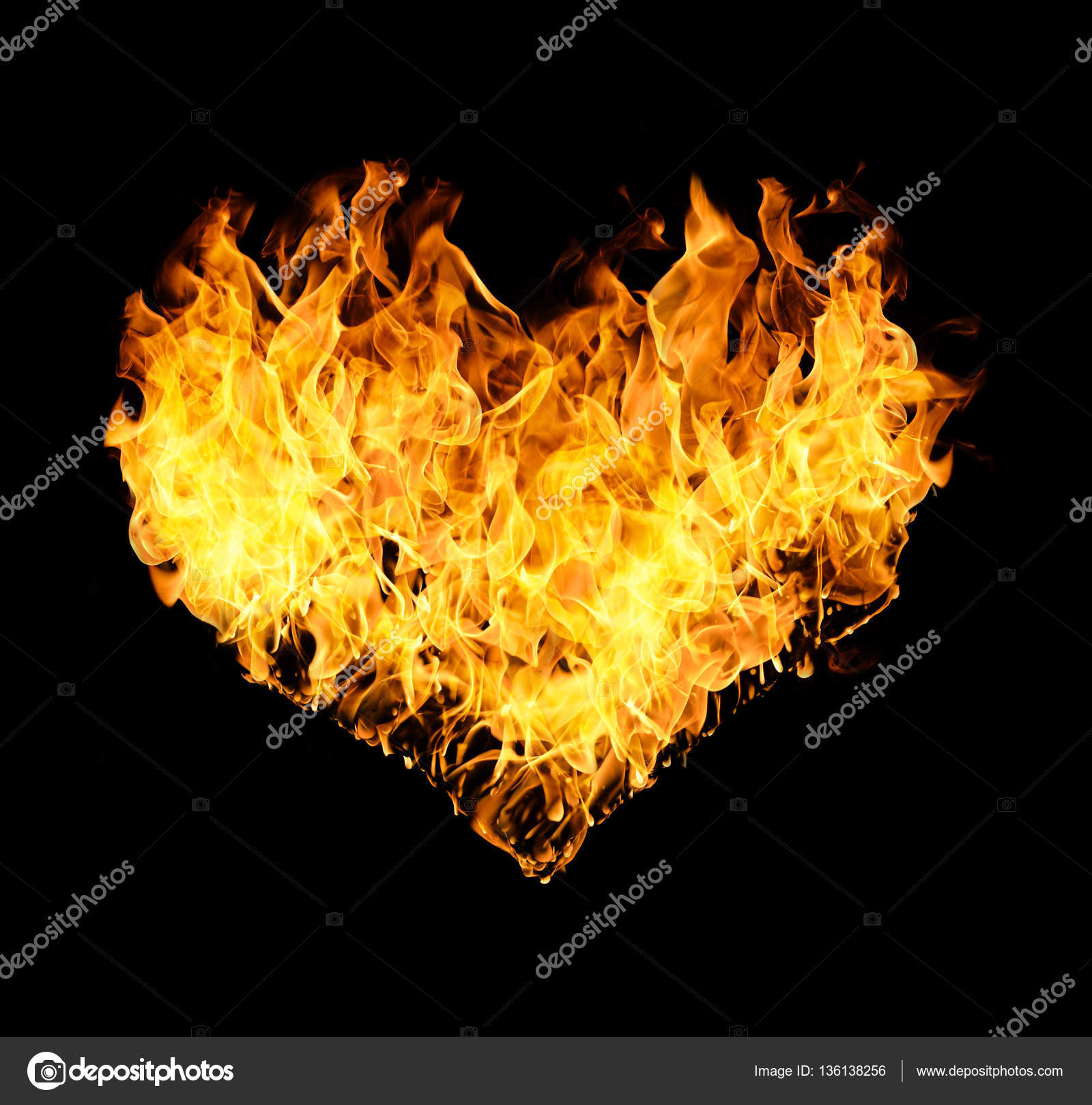 Fires flames in heart shape Stock Photo by ©vencav 136138256