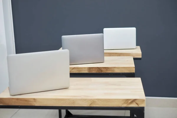 several laptops on the tables - Stock Image - Everypixel