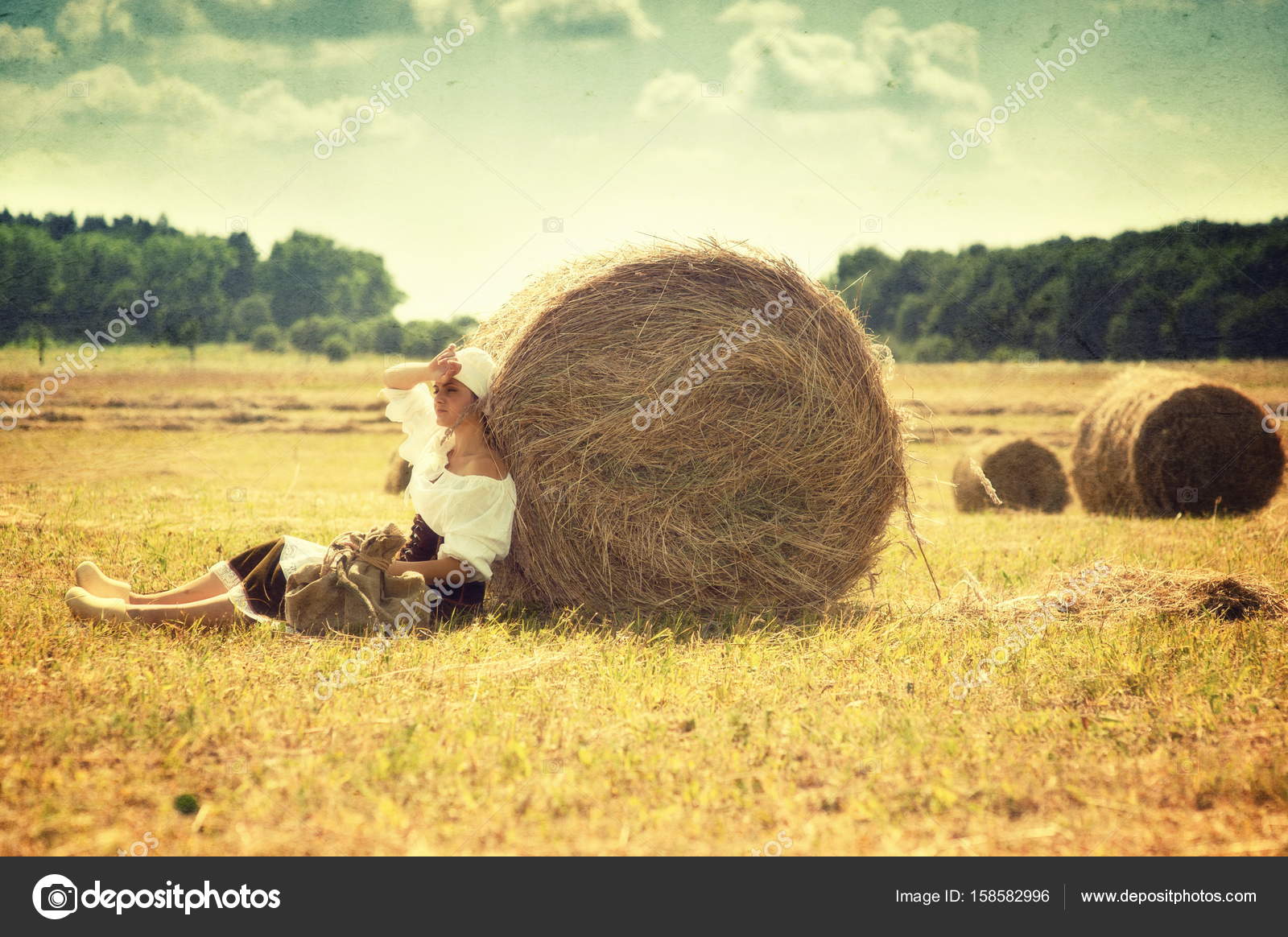 Rustic woman in countryside — Stock Photo © LadanivskyyO #158582996