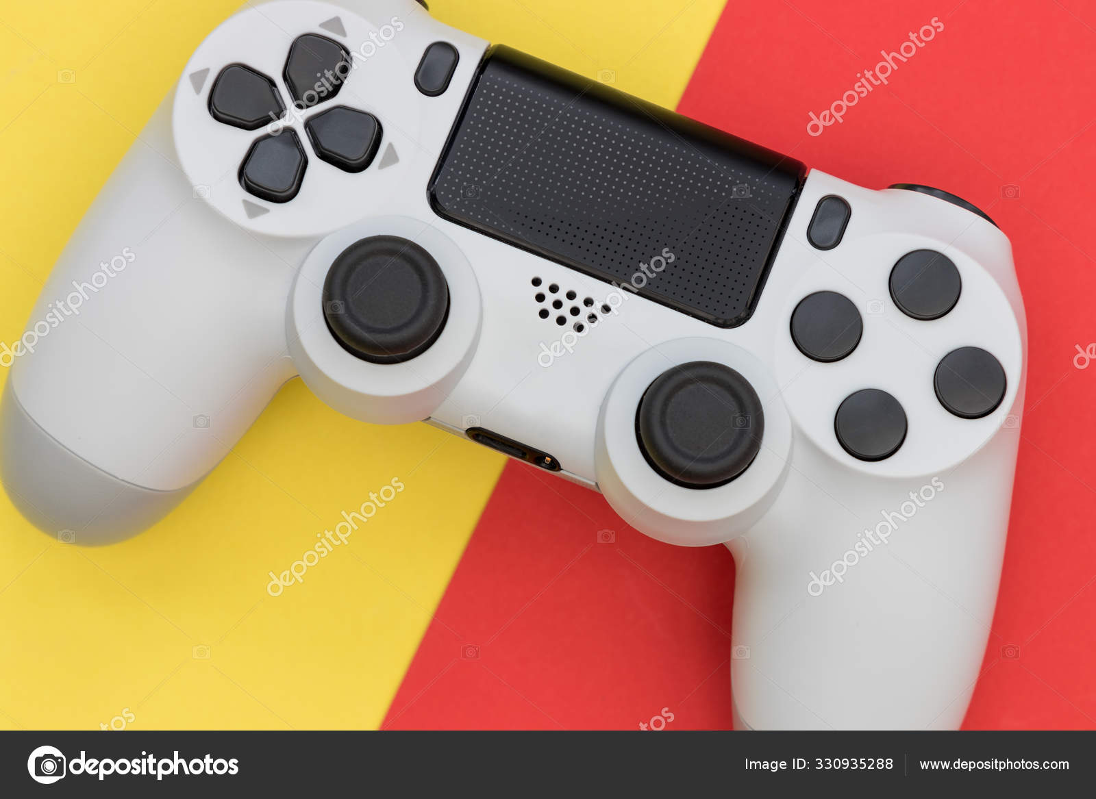 Video game gaming controller on bright red yellow color backgrou ...