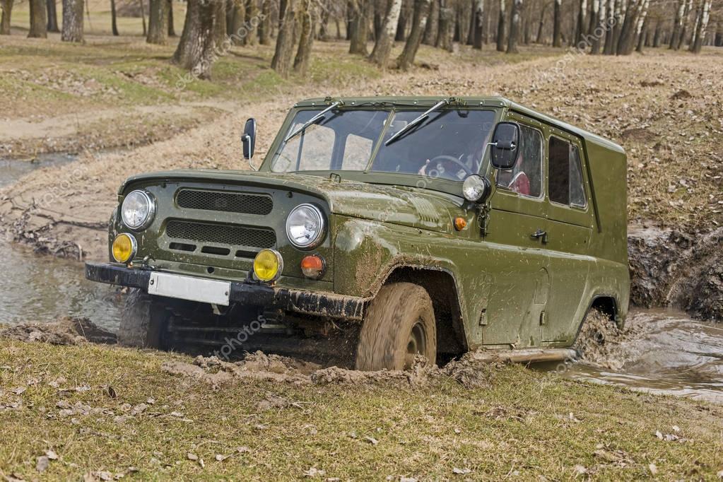 Russian SUV, Off-road vehicle slips, Stuck in the river – Stock ...