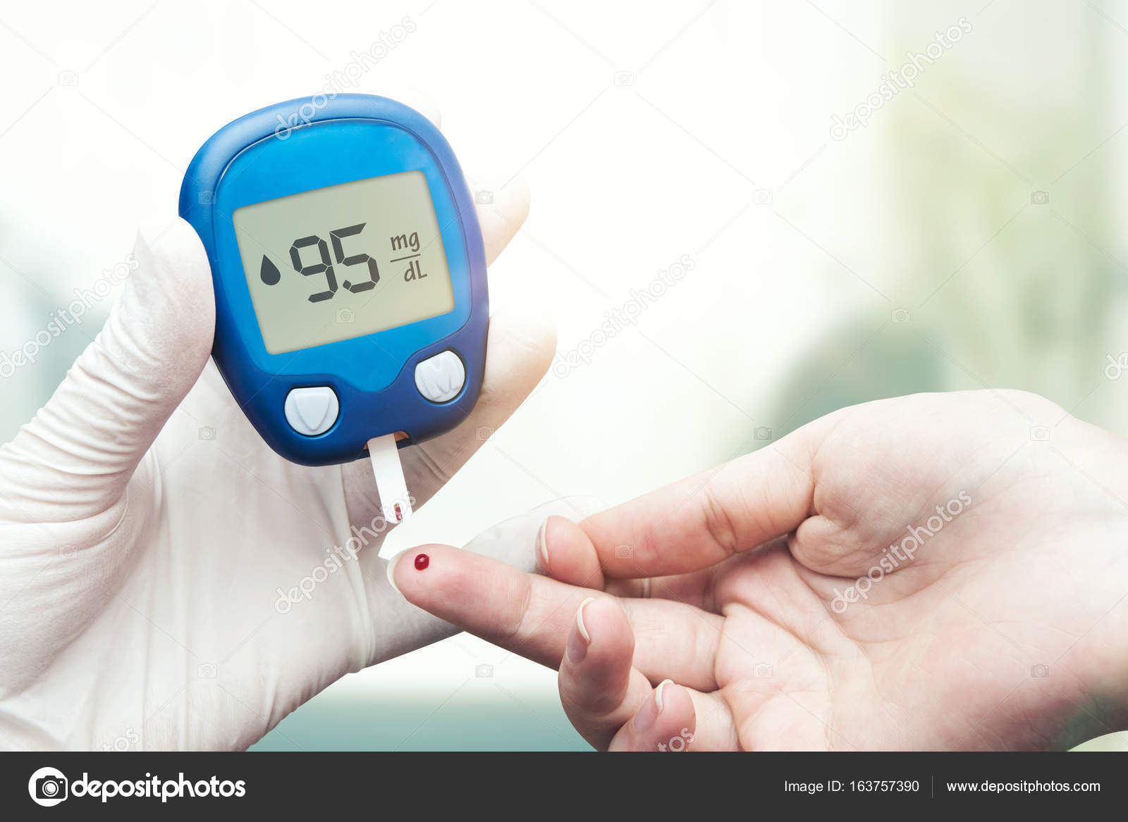 Doctor making blood sugar test. Stock Photo by ©simpson33 163757390