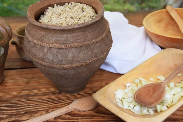 Medieval cooking porridge in a metal pot on the fire — Stock Photo ...