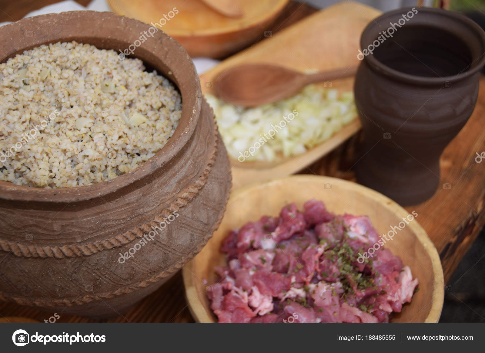 Boiled barley porridge in a clay pot on a bonfire with meat and — Stock ...