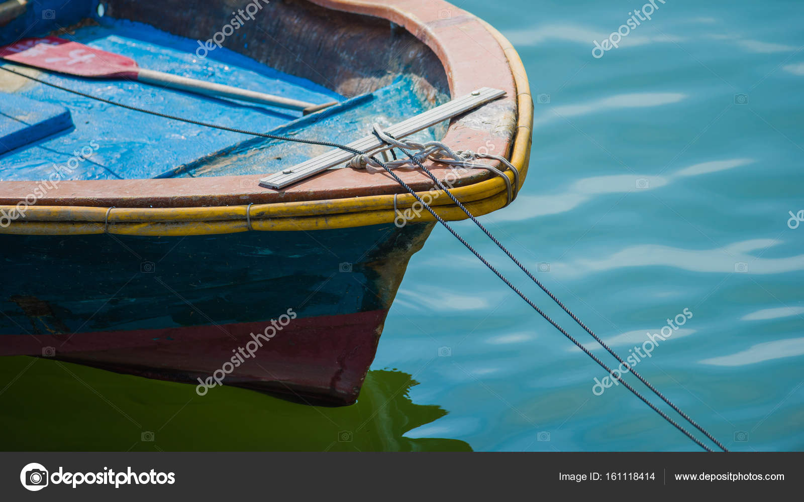 Empty boats on the sea Stock Photo by ©YMCPhoto 161118414