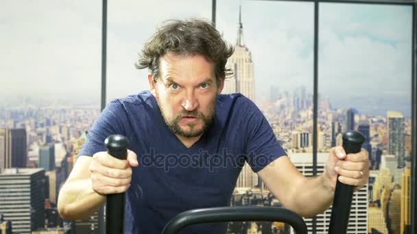 Strong cool man doing excersize in gym in city looking camera 4K slow ...