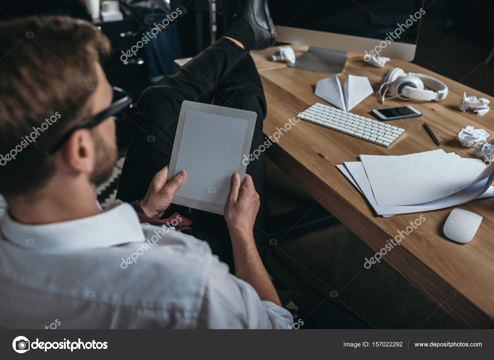 Businessman using digital tablet at workplace — Stock Photo ... Businessman using digital tablet at workplace — Stock Photo ...