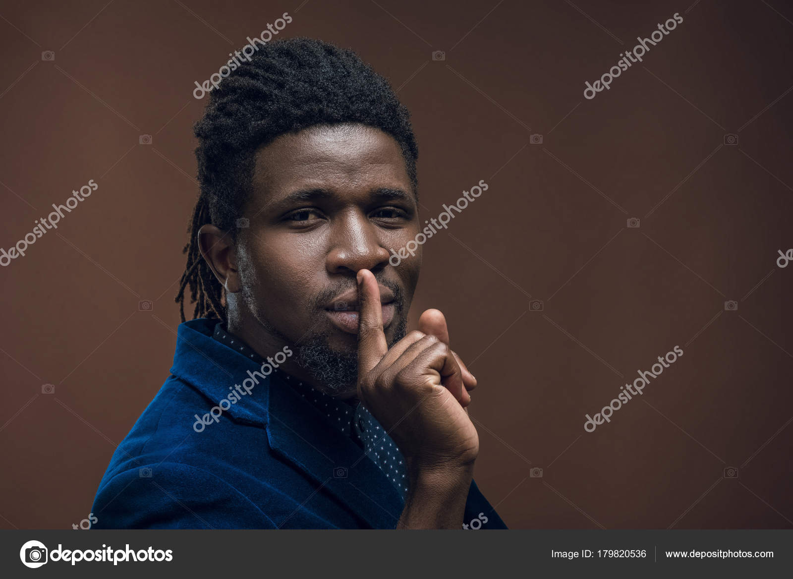 African american man showing silence gesture isolated on brown Stock ...