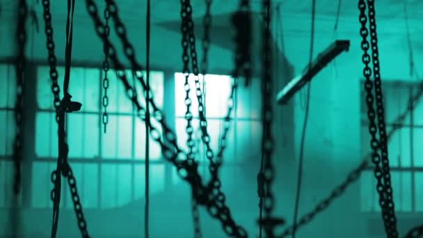 A lot of chins in the location. Room full of chains. Chains in dark ...