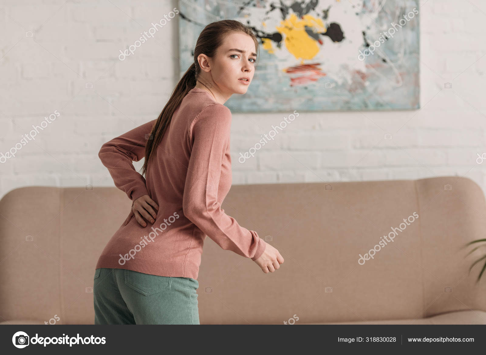 Young Woman Looking Camera While Suffering Back Pain — Stock Photo ...