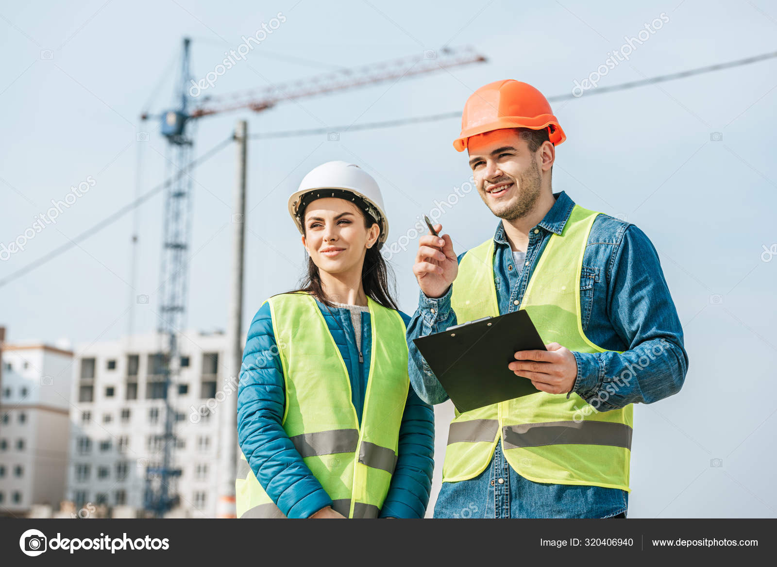Smiling Surveyor Clipboard Pointing Away Colleague Construction Site ...