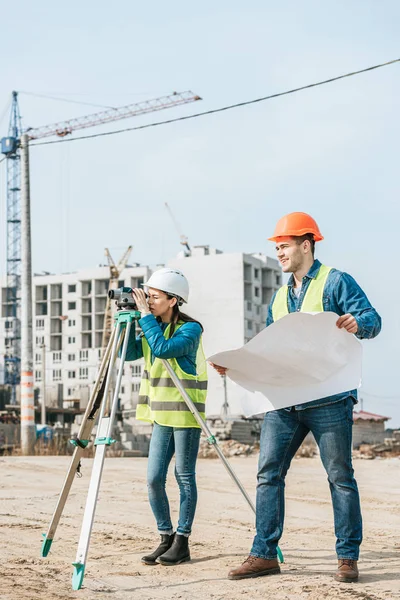 Selective Focus Female Surveyor Ruler Colleague Digital Level Field ...