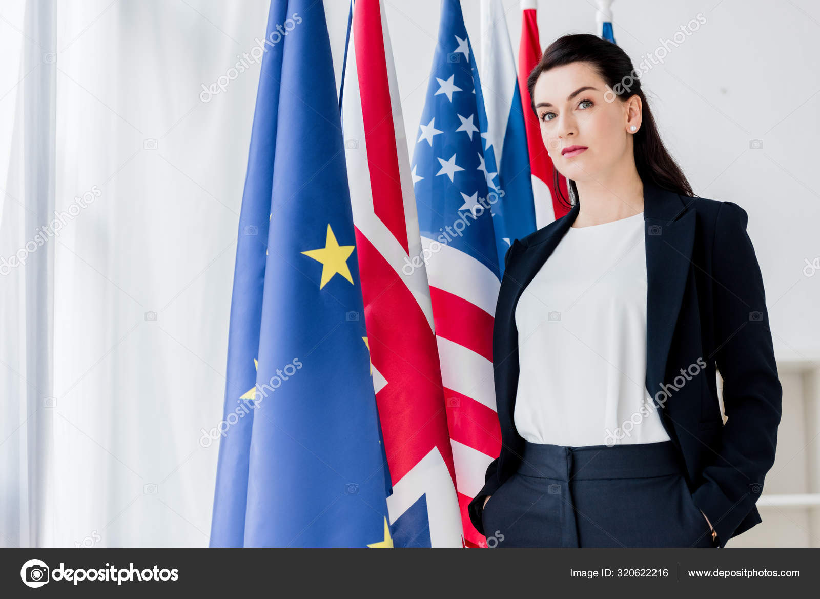 Beautiful Diplomat Standing Hands Pockets Flags Looking Camera — Stock ...