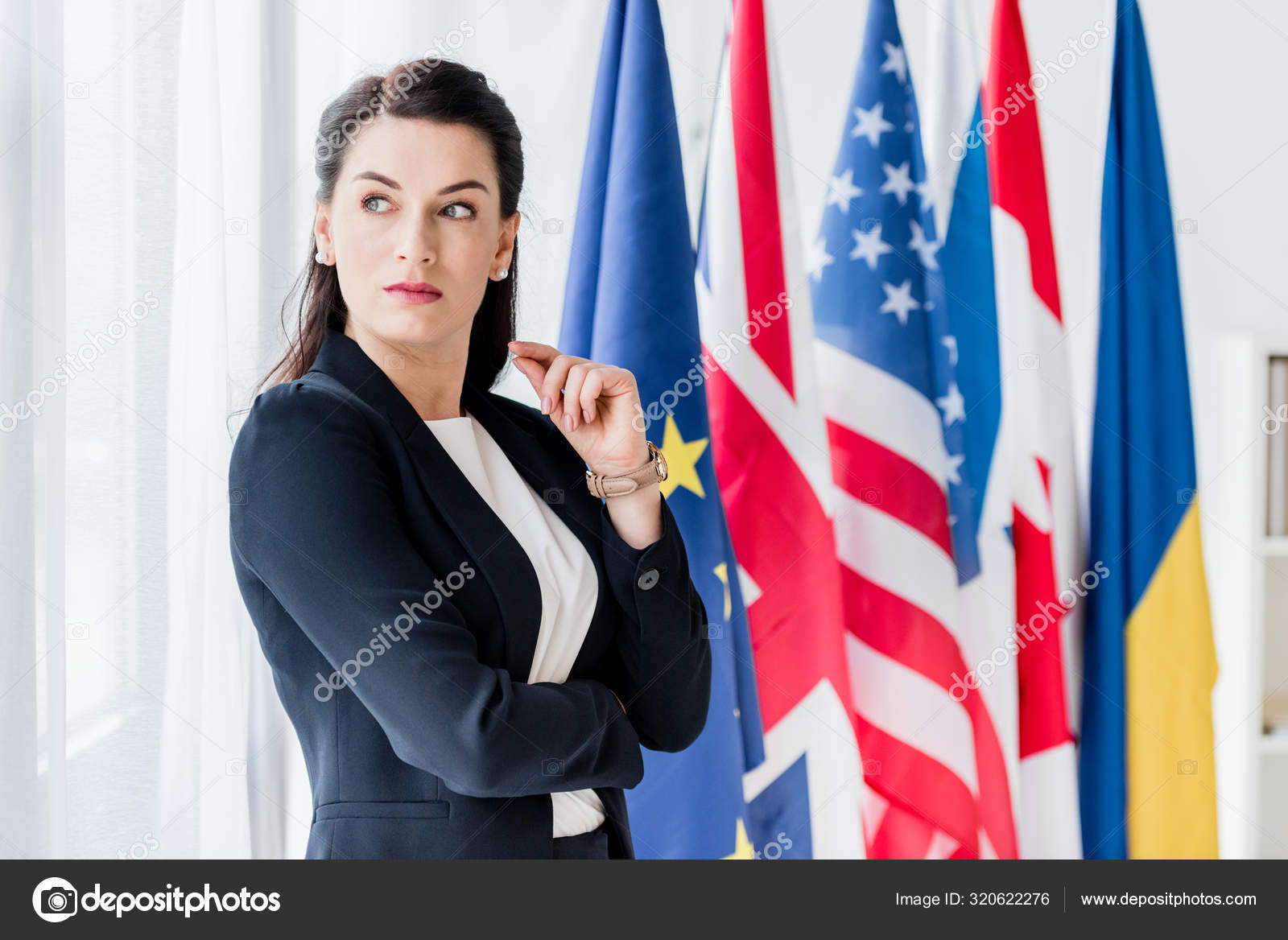 Attractive Diplomat Looking Away While Standing Flags — Stock Photo ...