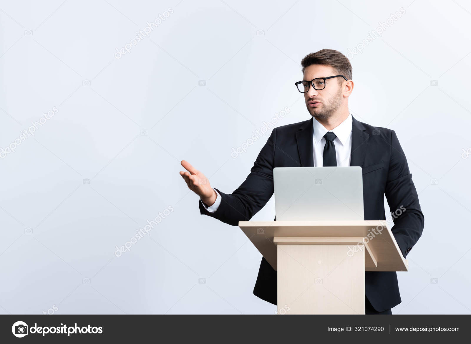 Person Speaking At Podium