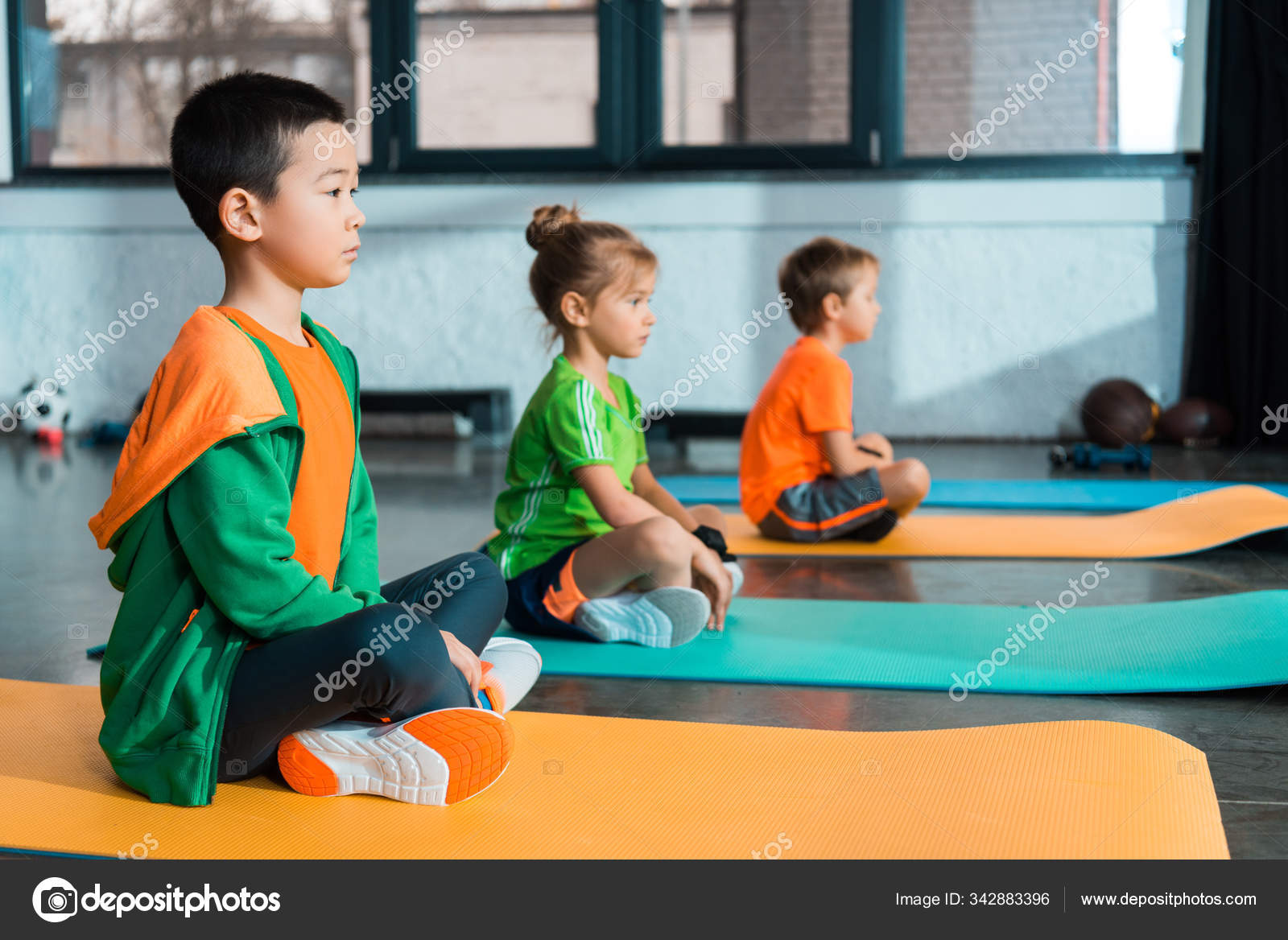 Selective Focus Multicultural Children Crossed Legs Sitting Fitness ...