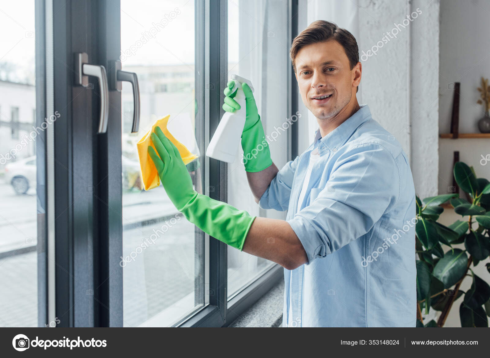 Side View Man Bottle Detergent Rag Smiling Camera While Cleaning ... Side View Man Bottle Detergent Rag Smiling Camera While Cleaning ...