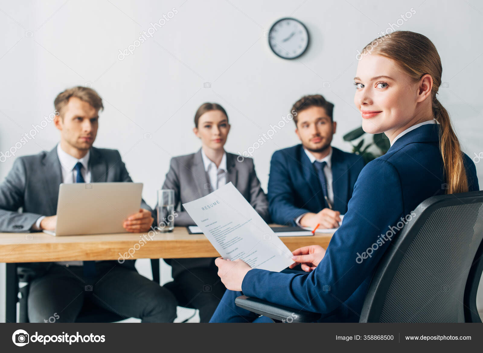 Selective Focus Employee Looking Camera While Holding Resume Recruiters ...