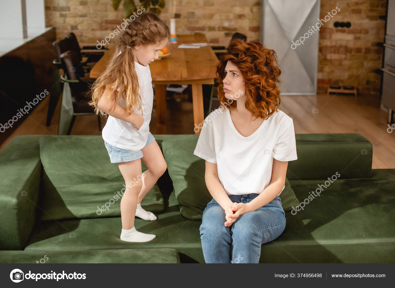 Offended Kid Standing Sofa Looking Upset Curly Mother — Stock Photo ...