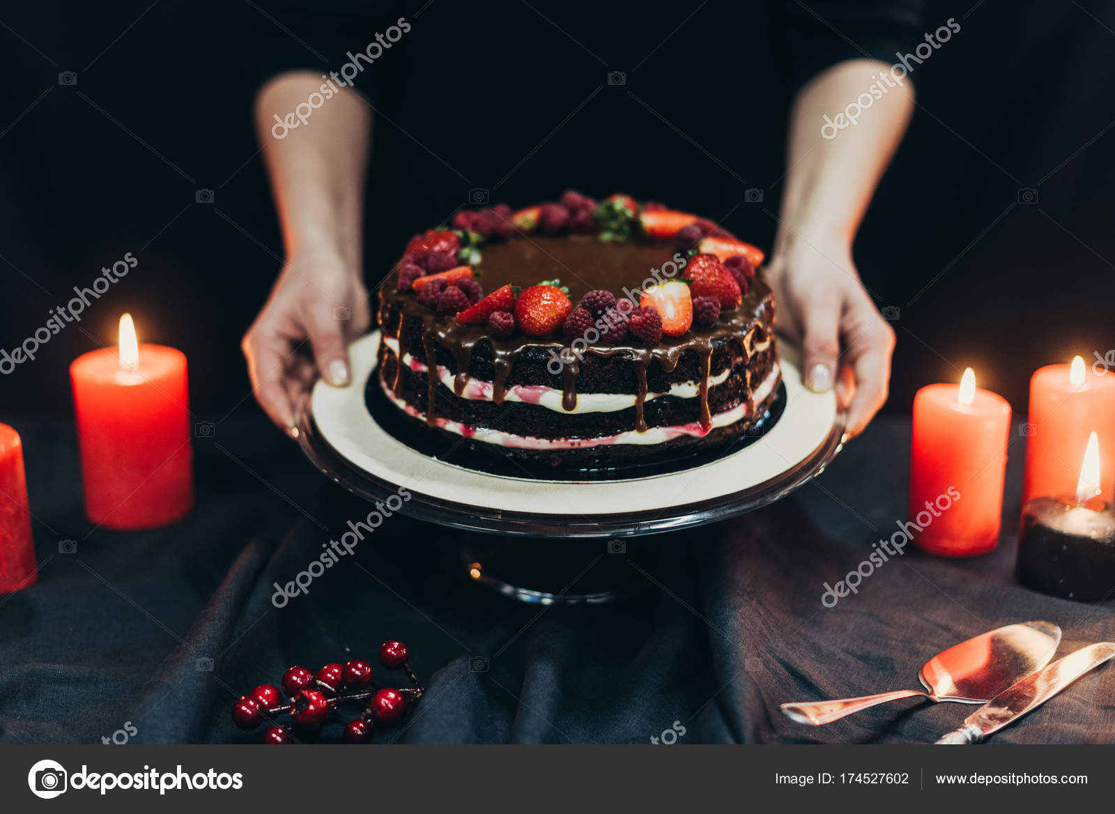 Woman putting cake stand on table — Stock Photo © ViktoriaSapata #174527602