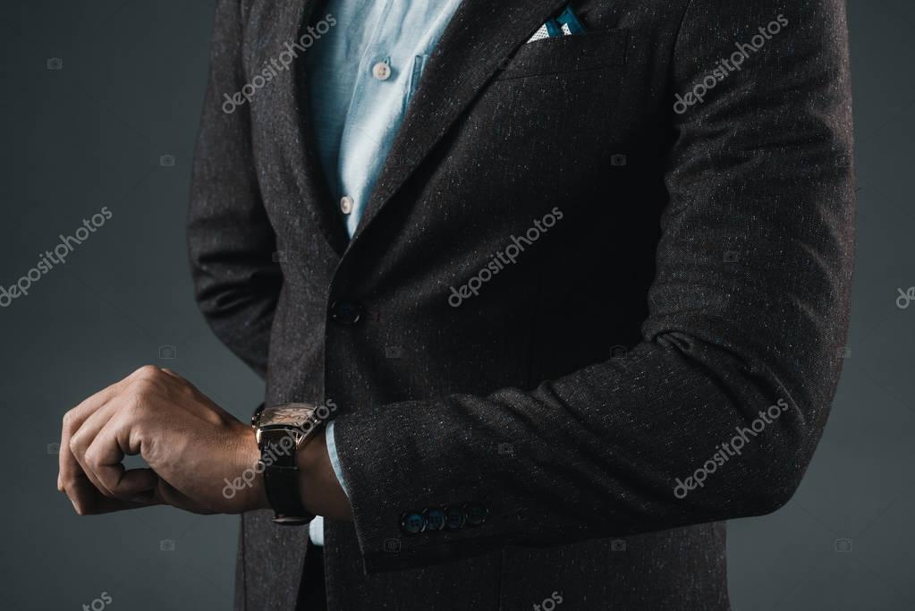 Stylish man looking at hand watches — Stock Photo © VitalikRadko #158547222