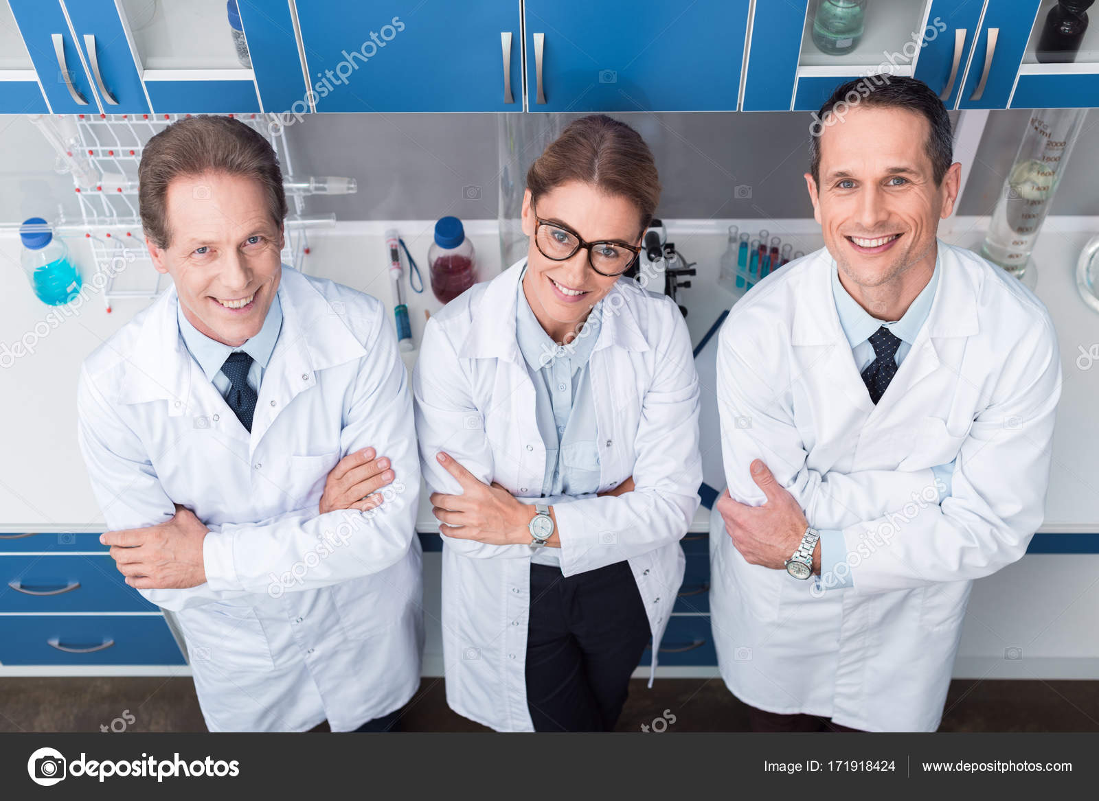 Team of scientists Stock Photo by ©VitalikRadko 171918424
