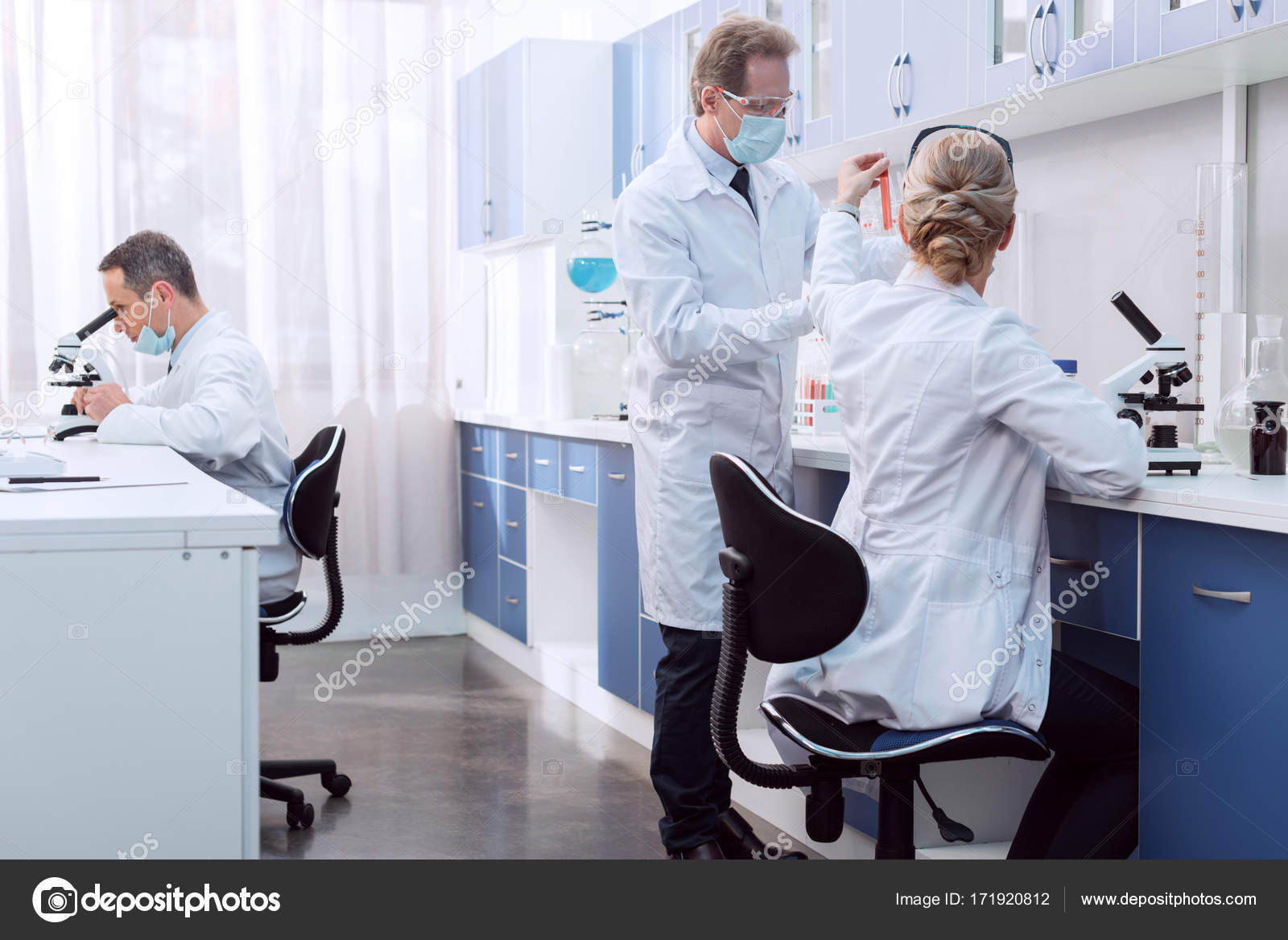 Scientists working in laboratory — Stock Photo © VitalikRadko #171920812