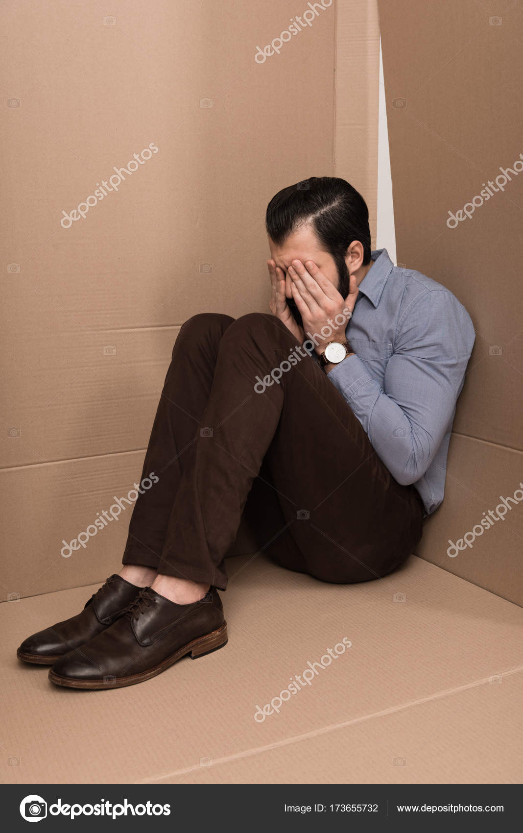 Depressed man crying in box — Stock Photo © VitalikRadko #173655732