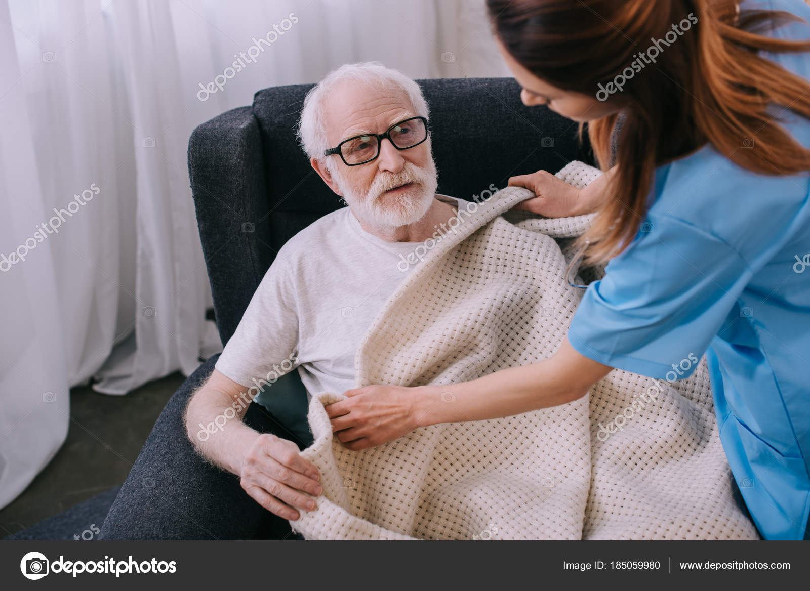 Caregiver Covering Senior Patient Plaid — Stock Photo © VitalikRadko ...