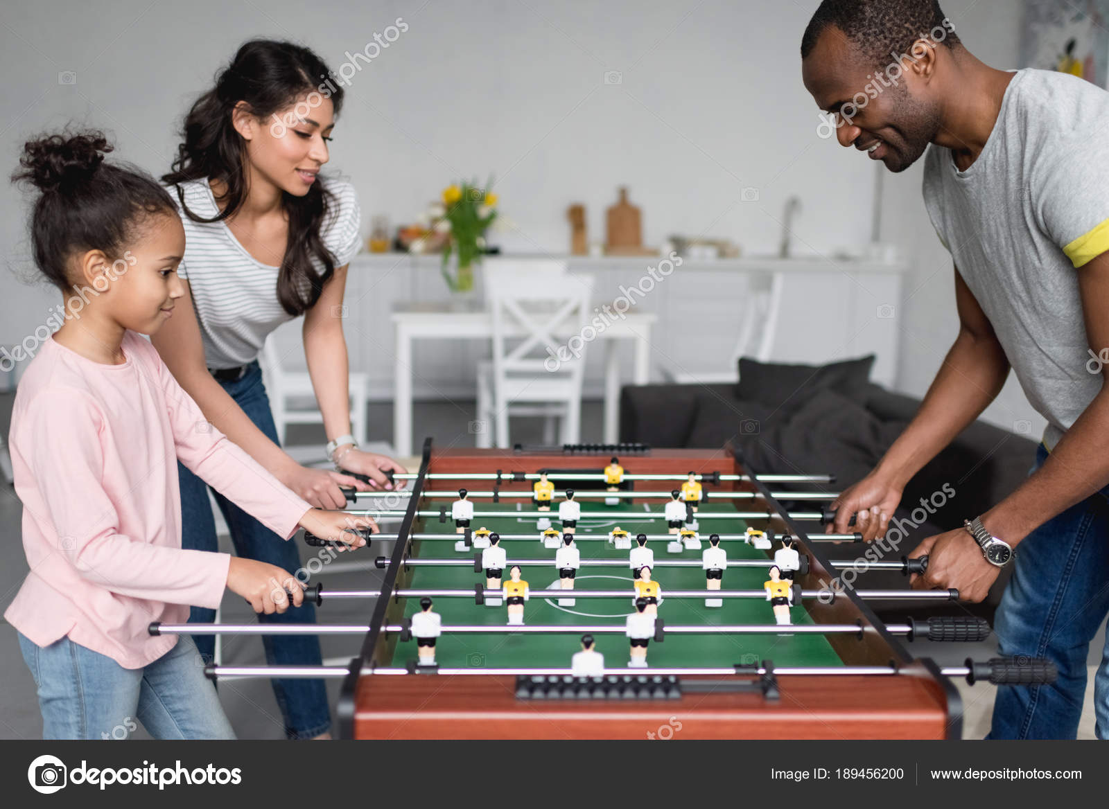 Family Playing Foosball